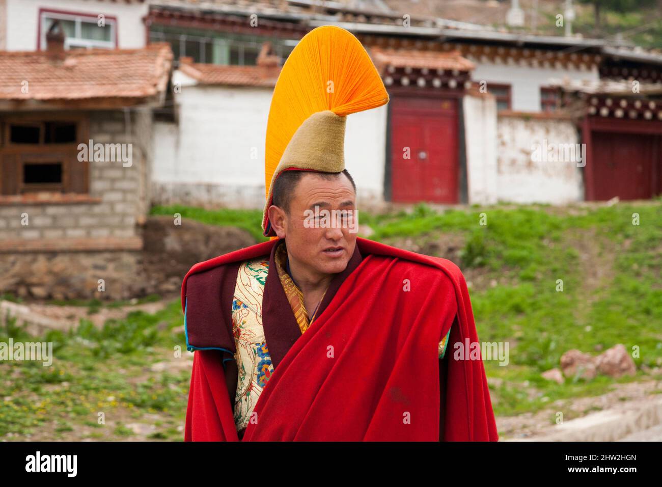Tibetan monks of the Buddhist gelugpa sect with traditional yellow cap ...