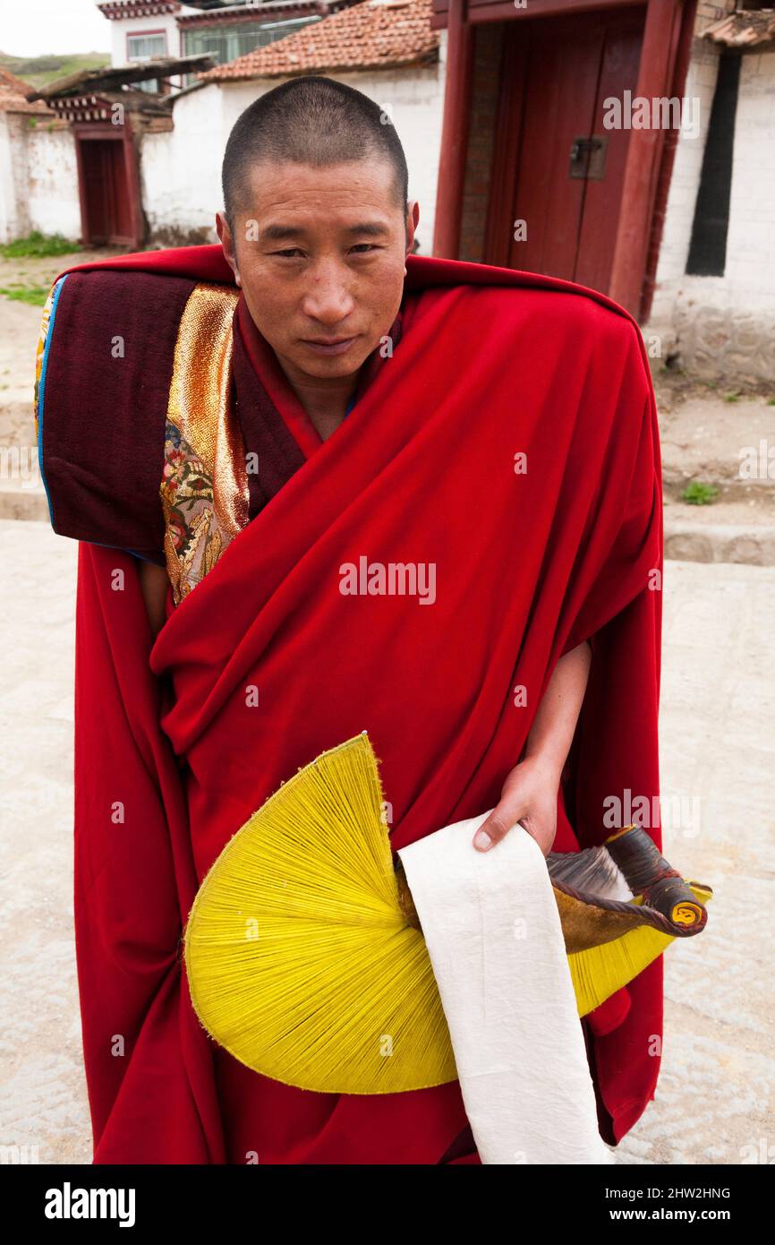 Tibetan monks of the Buddhist gelugpa sect with traditional yellow cap ...