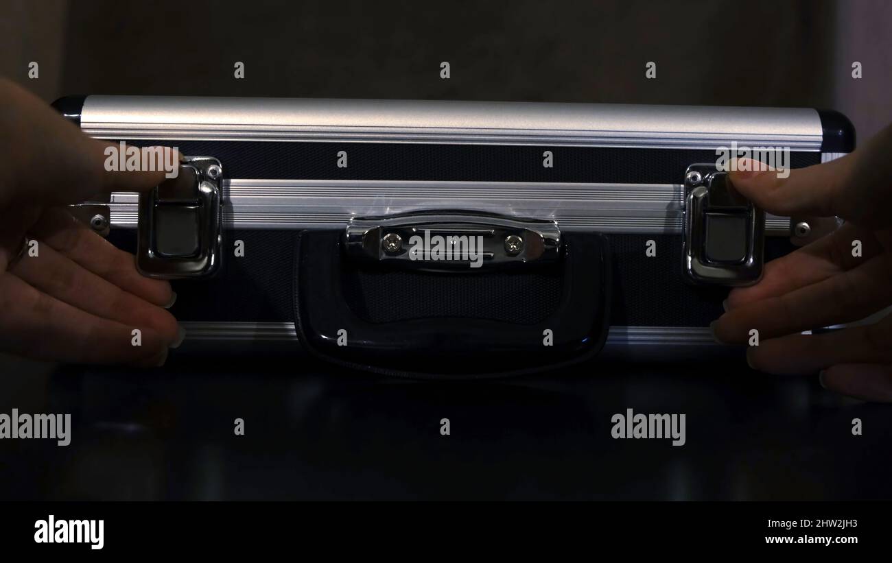 Mysterious black briefcase hi-res stock photography and images - Alamy