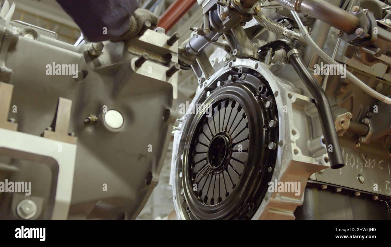 Close-up of large part of factory machine on background of factory and ...