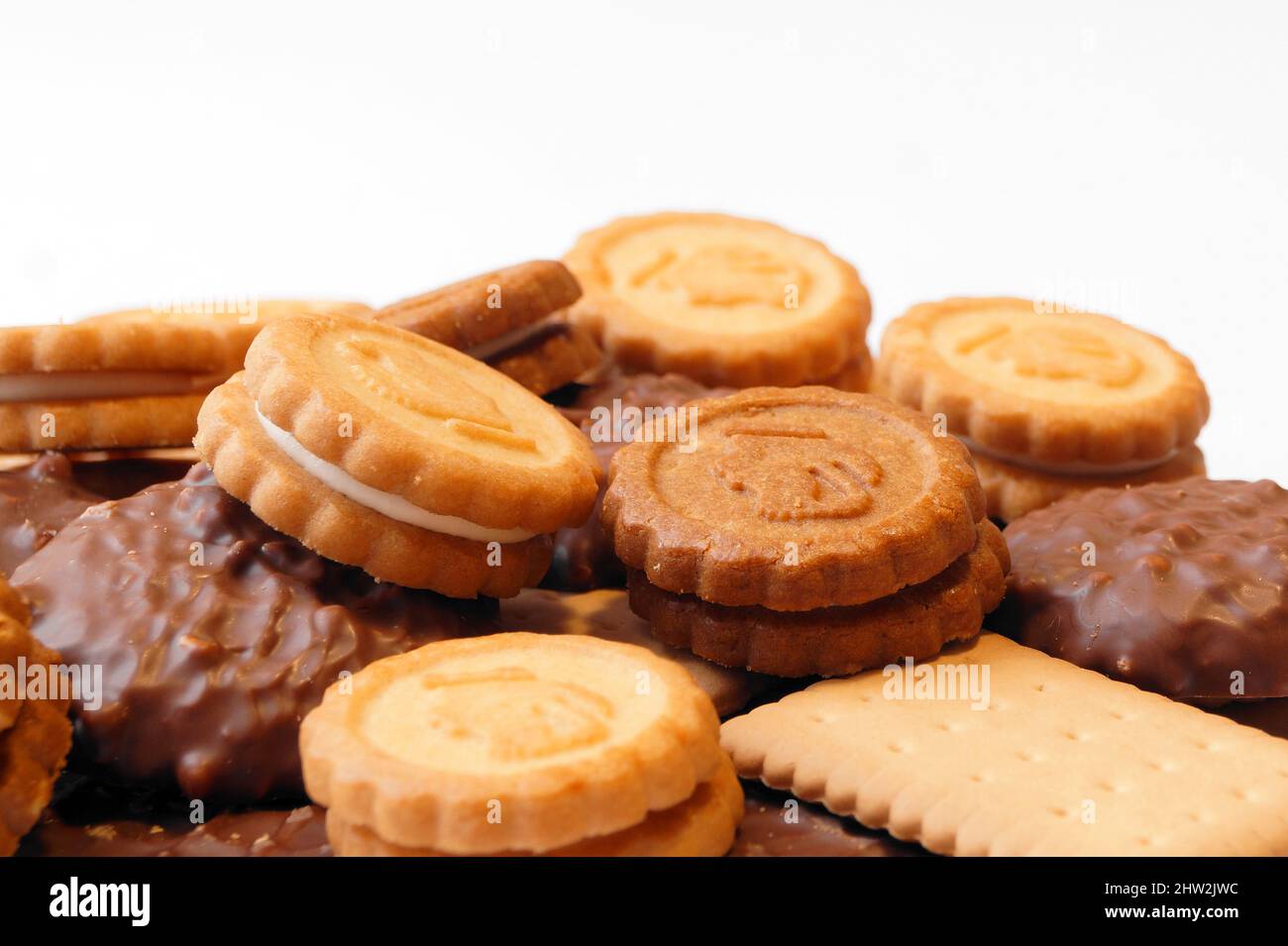 Cookies of different types and shapes lie on top of each other Stock ...