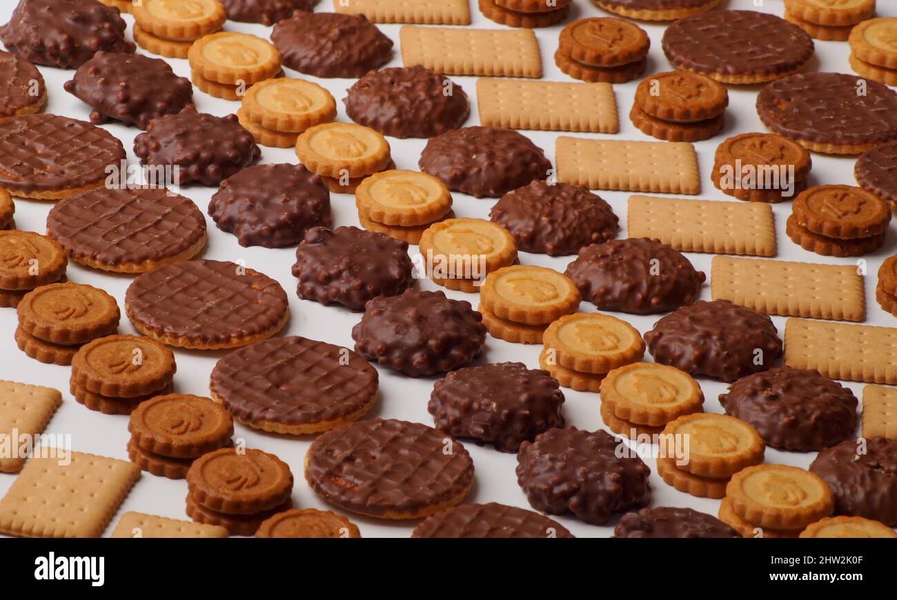 Close-up photo of beautiful chocolate glazed cookies, round filled and ...