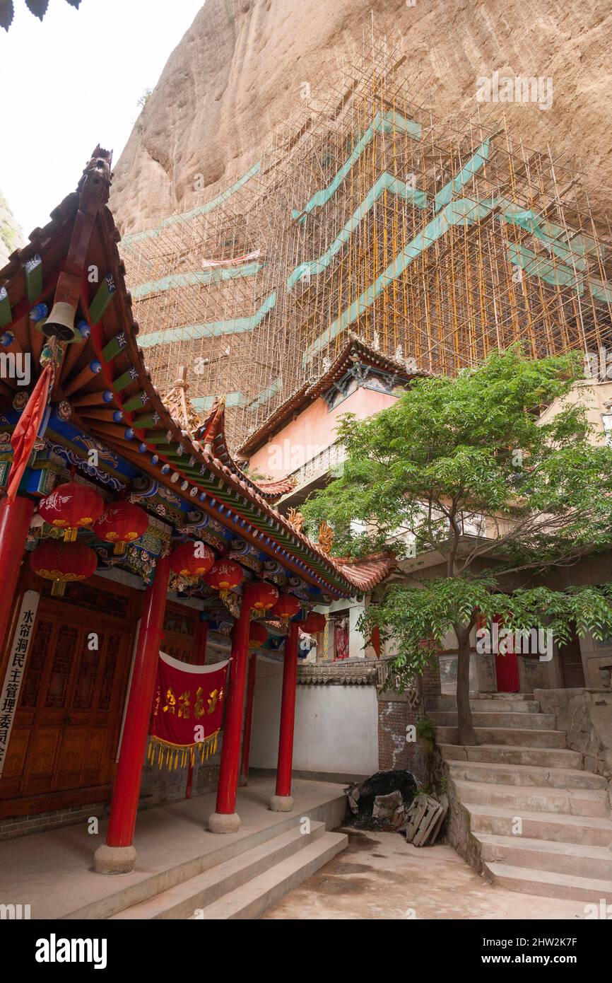 Scaffold / scaffolding on the mountain side where ancient caves were ...
