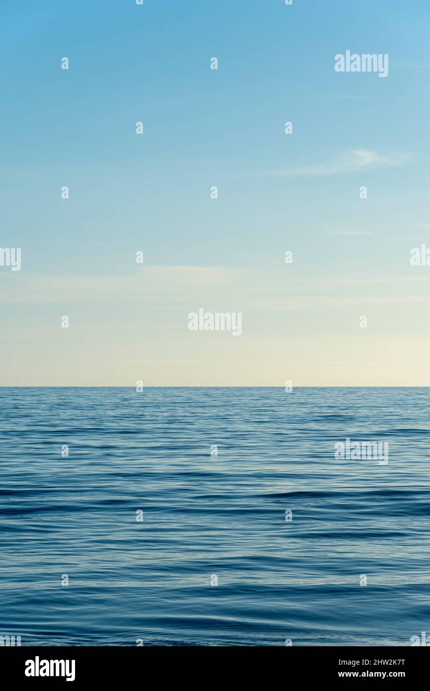 clear sky and calm sea or ocean water surface background Stock Photo ...