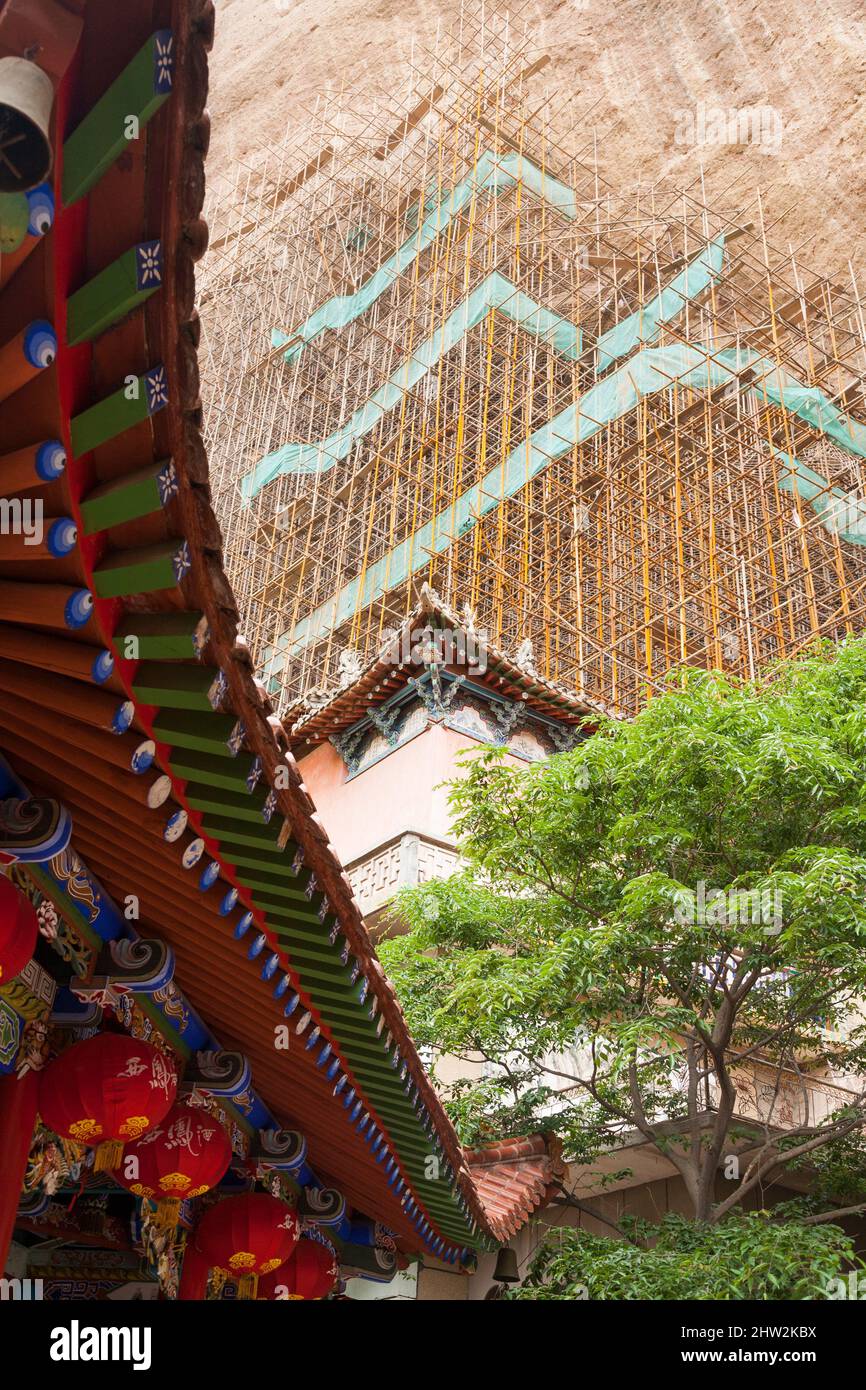 Scaffold / scaffolding on the mountain side where ancient caves were ...