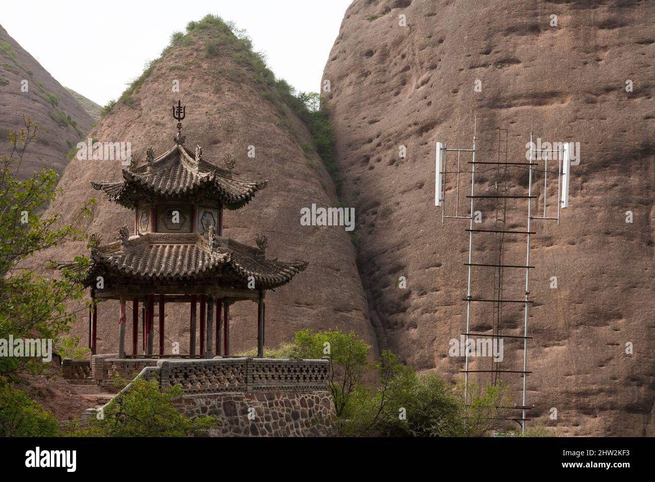 Small pagoda and what appears to be a mobile phone telecommunications ...
