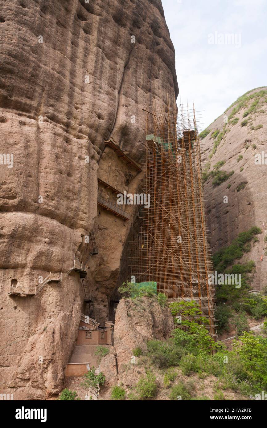 Scaffold / scaffolding on the mountain side where ancient caves were ...