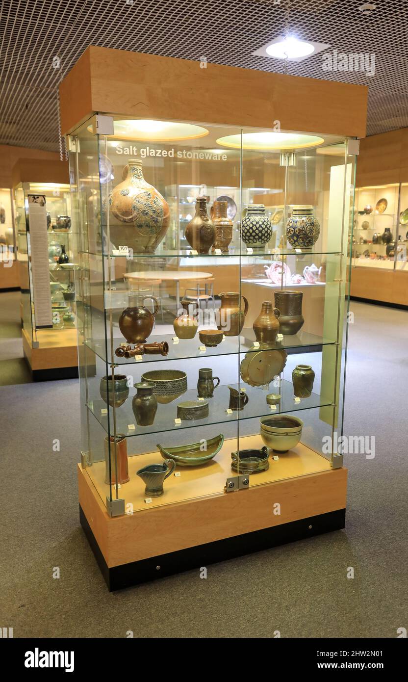 Salt glazed stoneware in a cabinet on display at the Potteries Museum ...