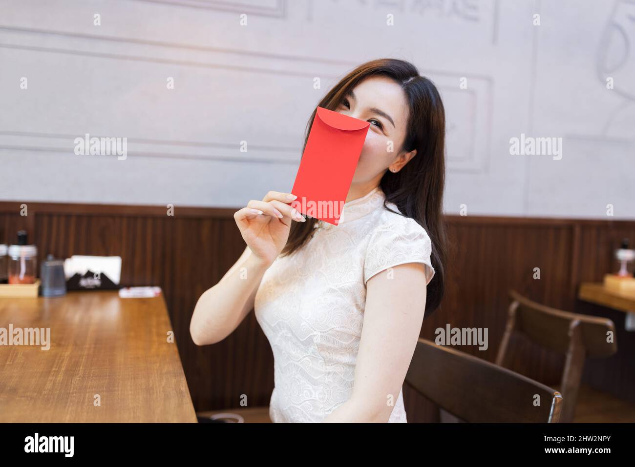 Beautiful young asian woman in traditional white dress named cheongsam ...