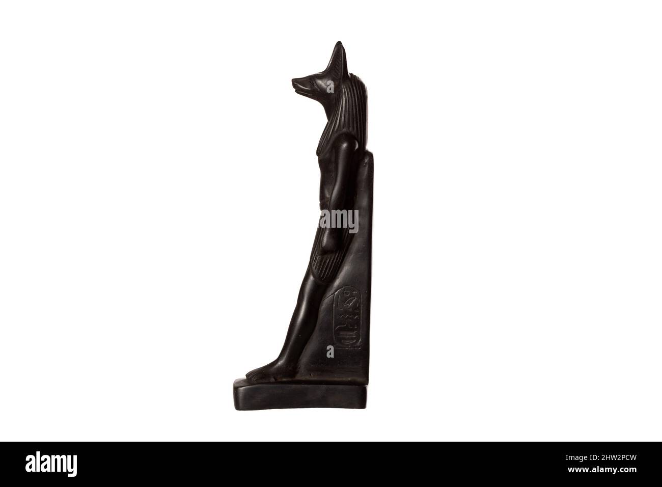 stone figurine of egyptian god Anubis with jackal head isolated on white background. side view ...