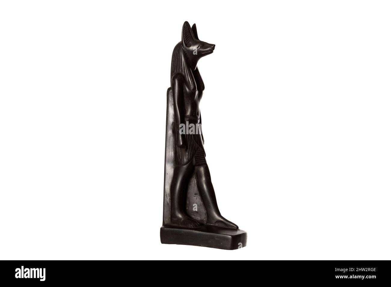 stone figurine of egyptian god Anubis with jackal head isolated on white background. side view ...