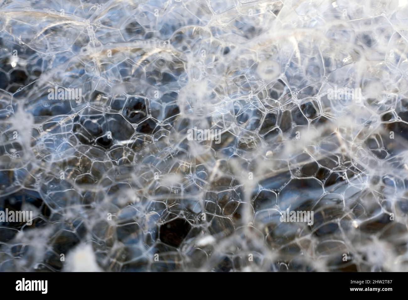 A soap bubbles, an extremely thin film of soapy water enclosing air in ...
