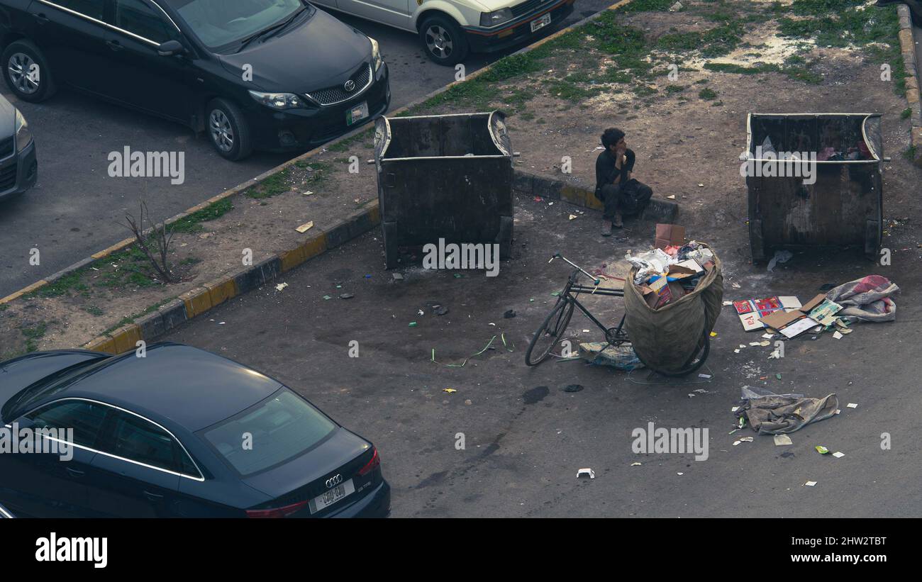 poor kids eating near garbage carts Stock Photo - Alamy
