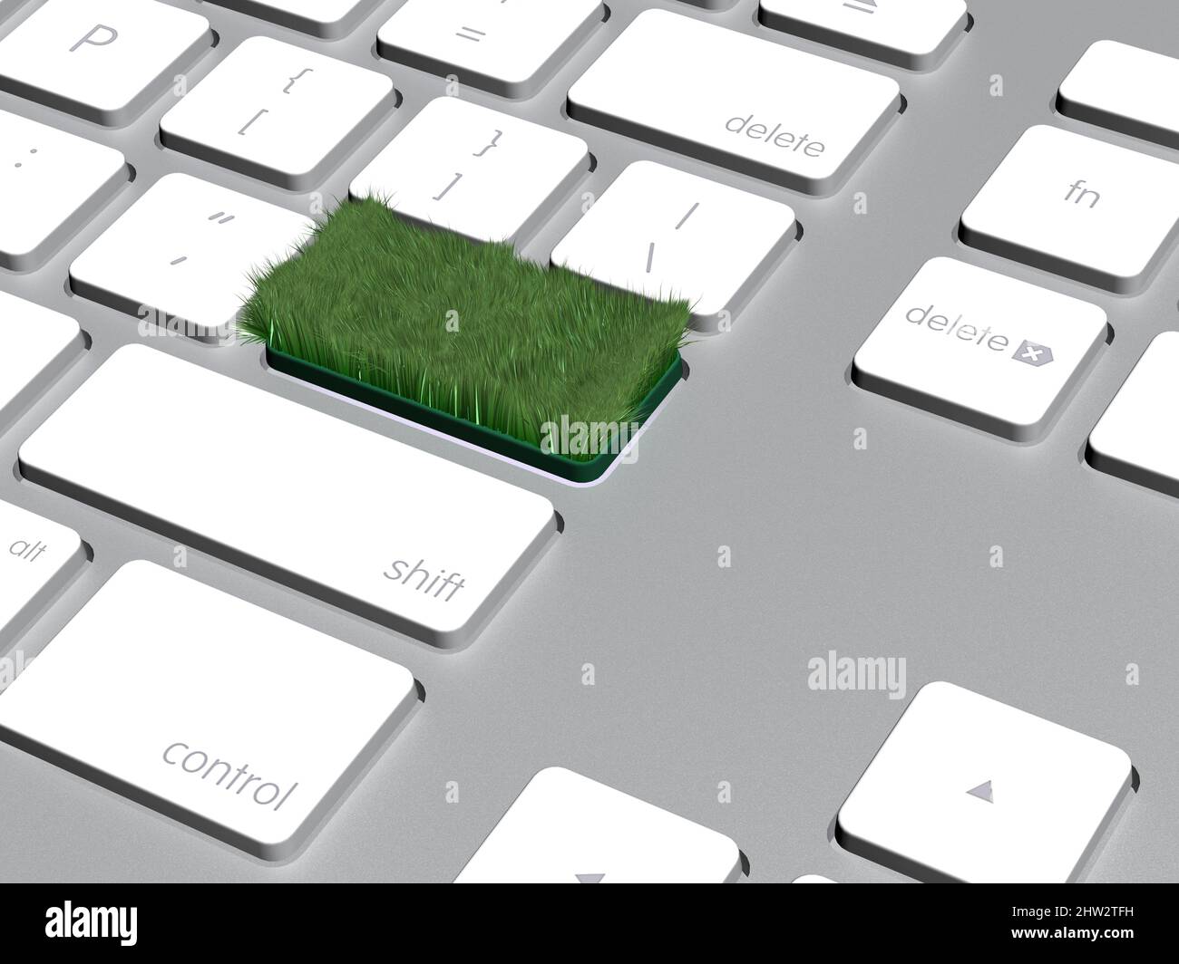 Laptop keyboard with green grass on enter key, digital sustainability ...
