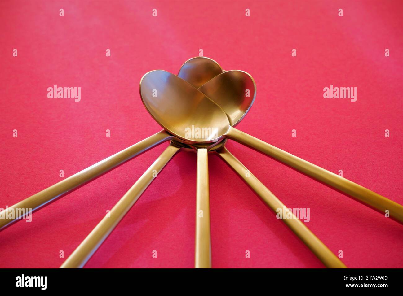Top view of teaspoons on a red background Stock Photo - Alamy