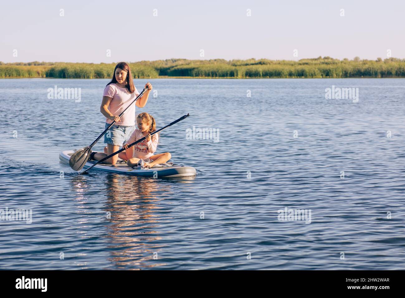 Smiling holding oars sport hi-res stock photography and images - Alamy