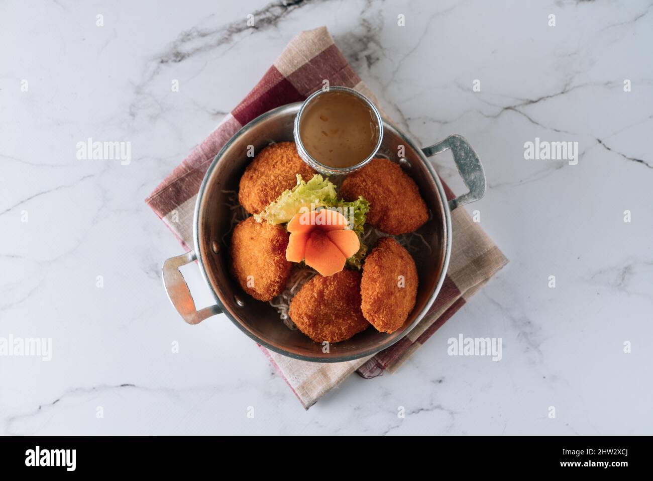 deep fried prawn cake with vegetable and sauce in a dish isolated on ...