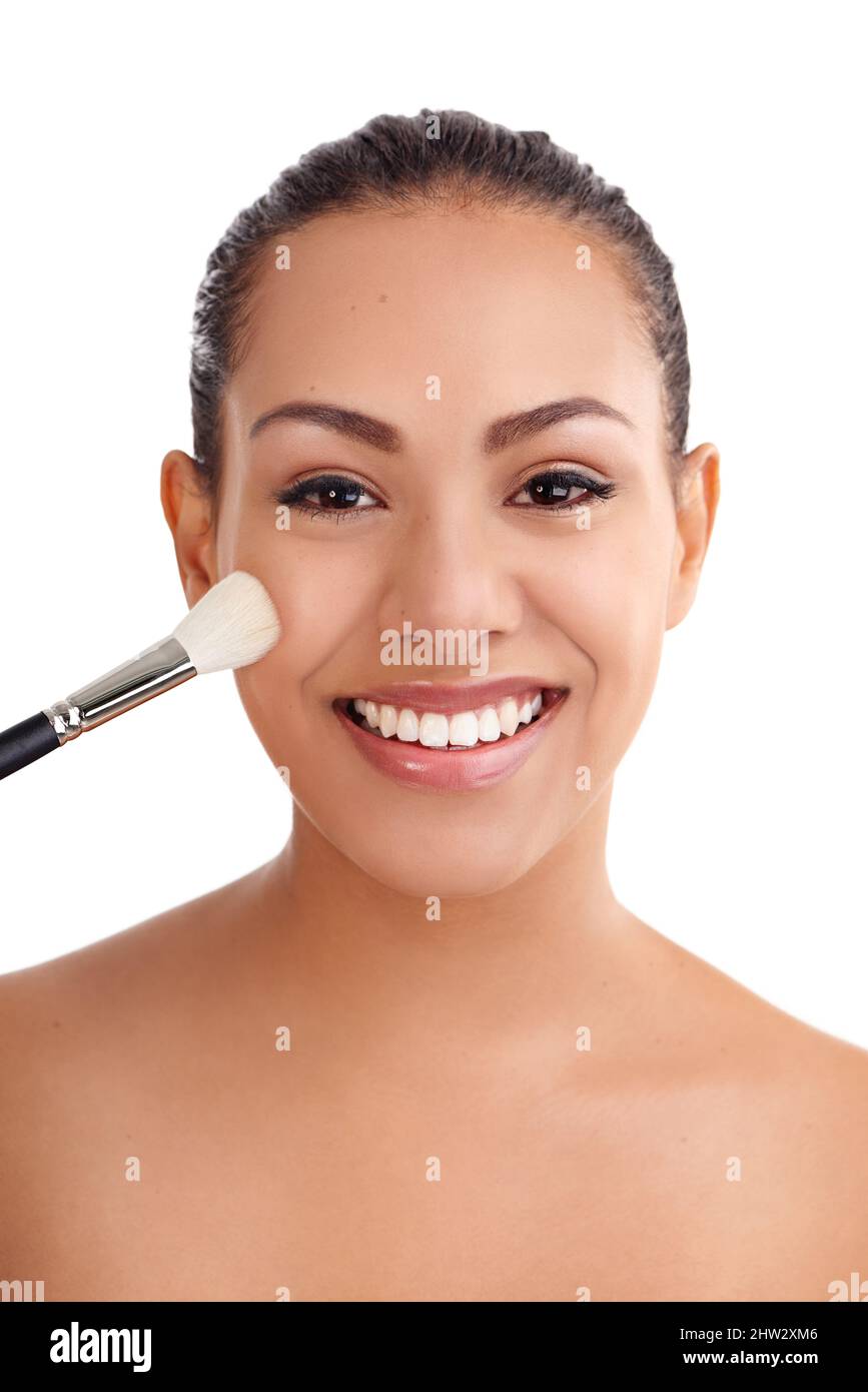 Enhancing her natural beauty with a touch of blush. Studio shot of a ...