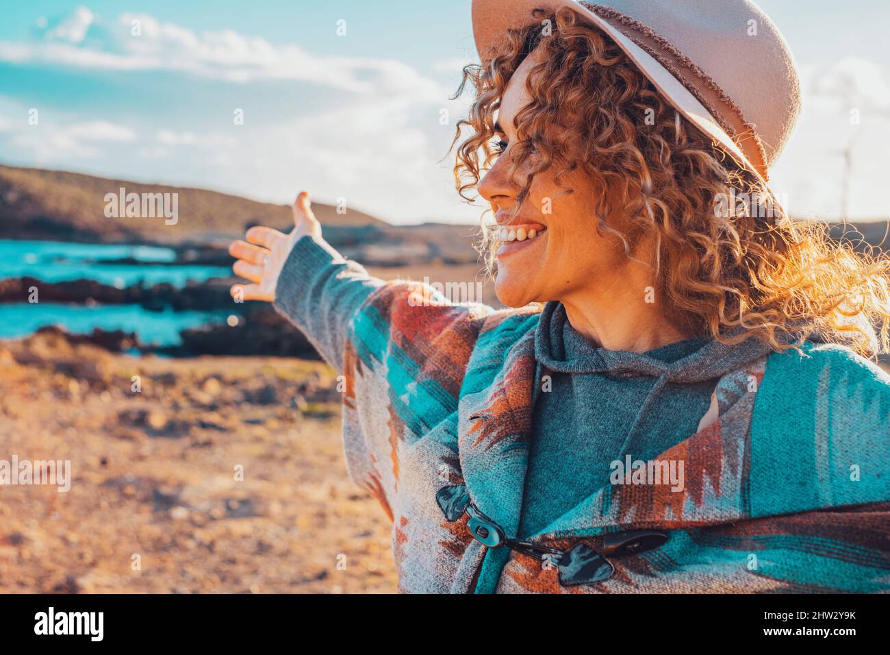 Cheerful pretty adult woman enjoy outdoors beautiful destination ...