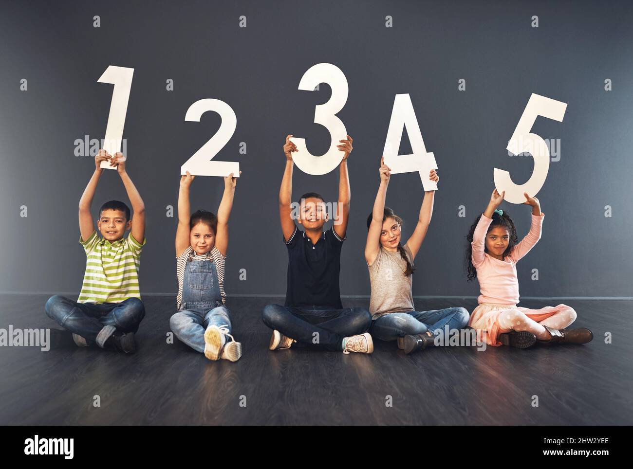 First rule of learning Have fun. Studio portrait of a diverse group of ...