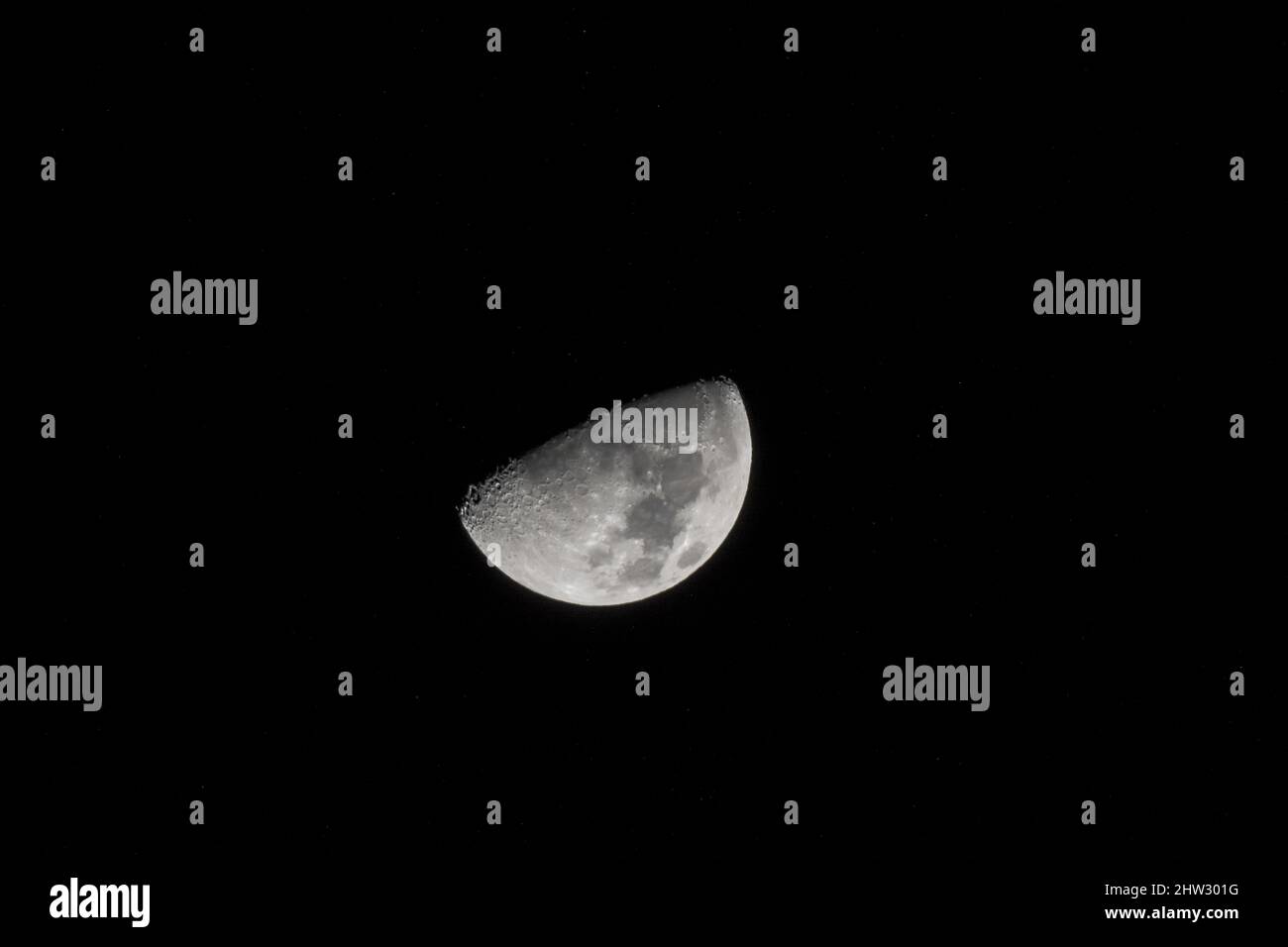 Beautiful waning gibbous moon on a dark background Stock Photo - Alamy