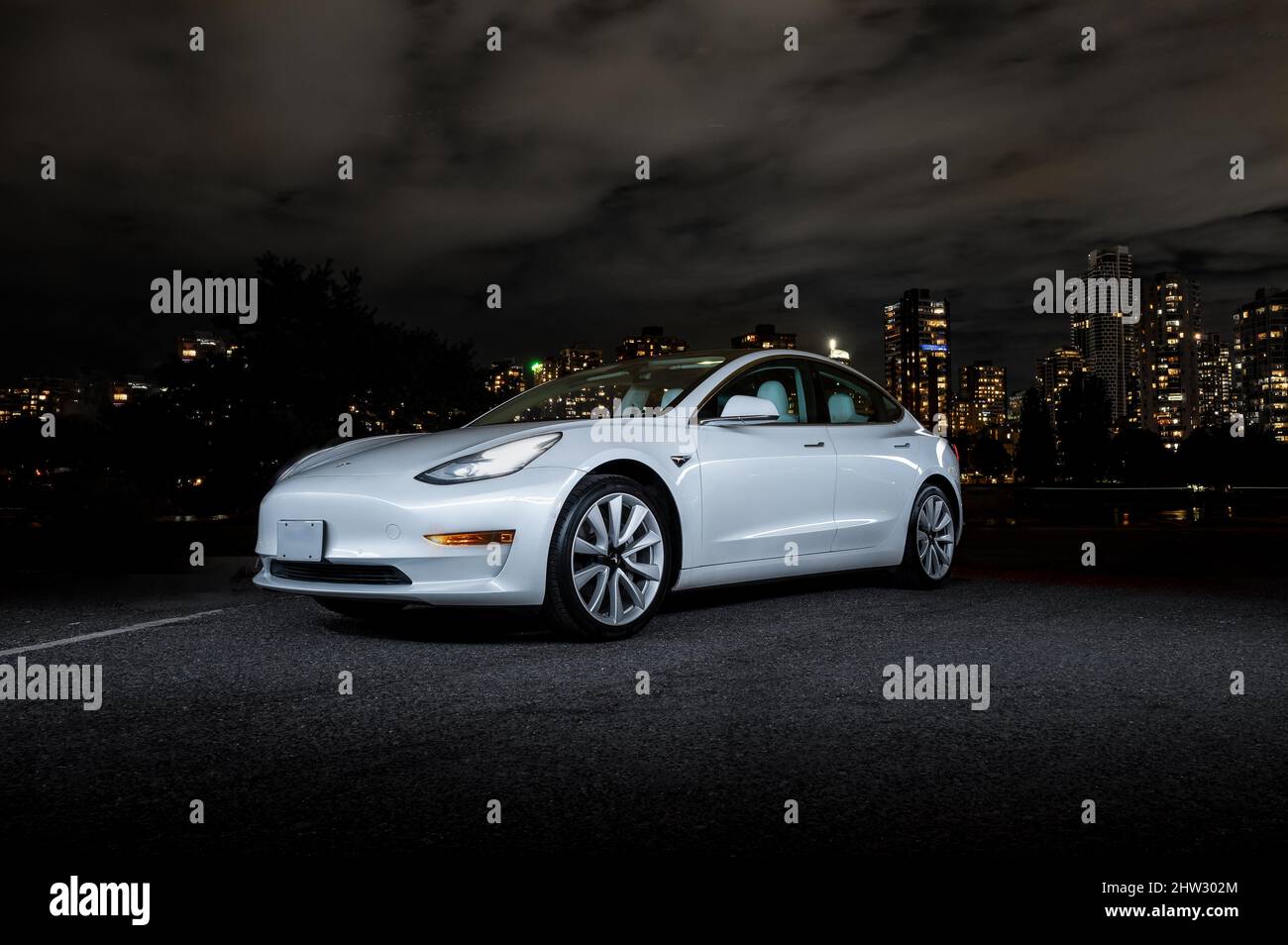 Tesla Model 3 at night Vancouver City by the public boat ramp Stock ...
