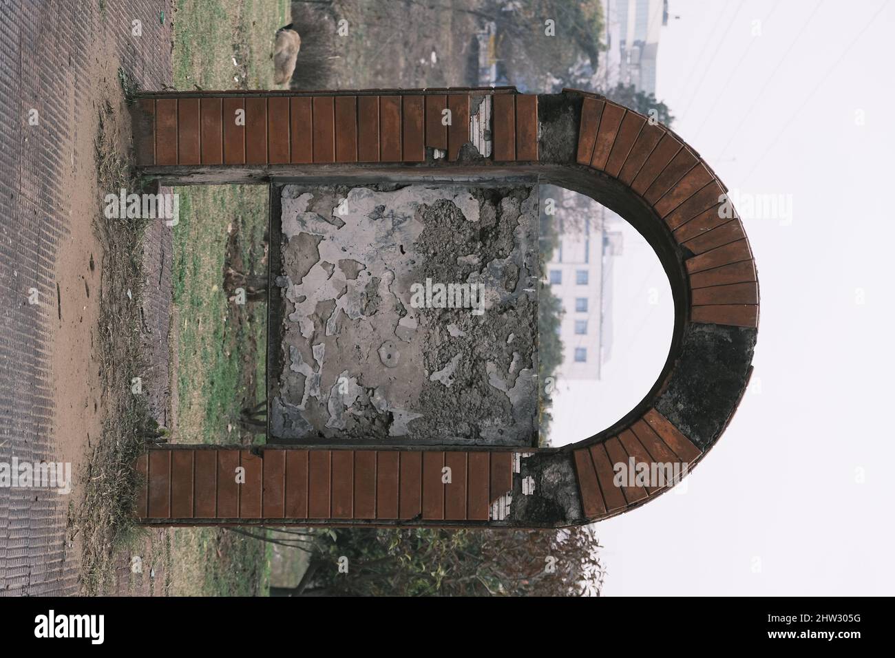 Completely worn-out notice board built into a brick arch Stock Photo ...
