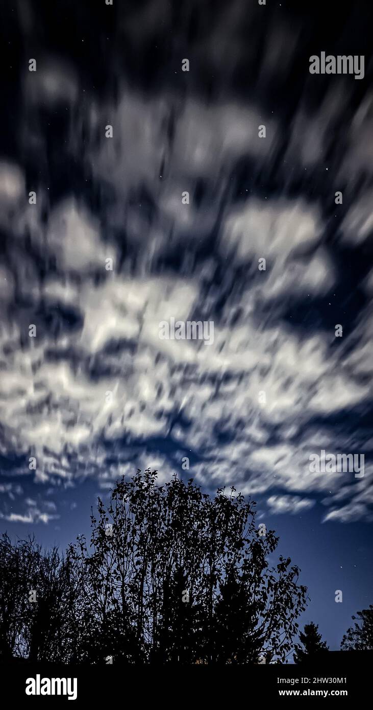 Beautiful view of a cloudy sky over the forest Stock Photo - Alamy