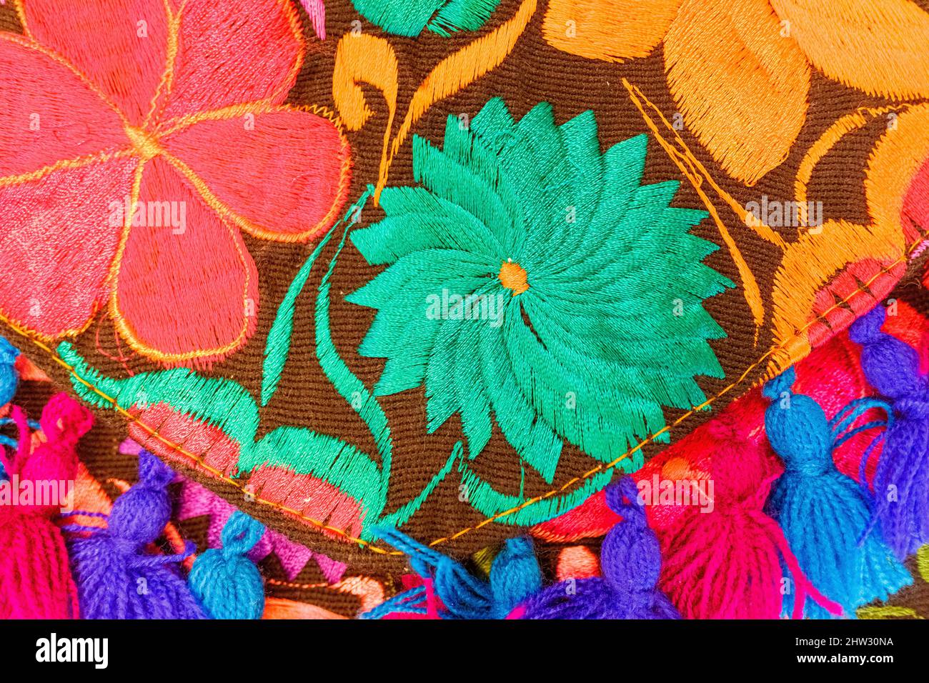 Embroidered flower design with colorful threads on a traditional ...