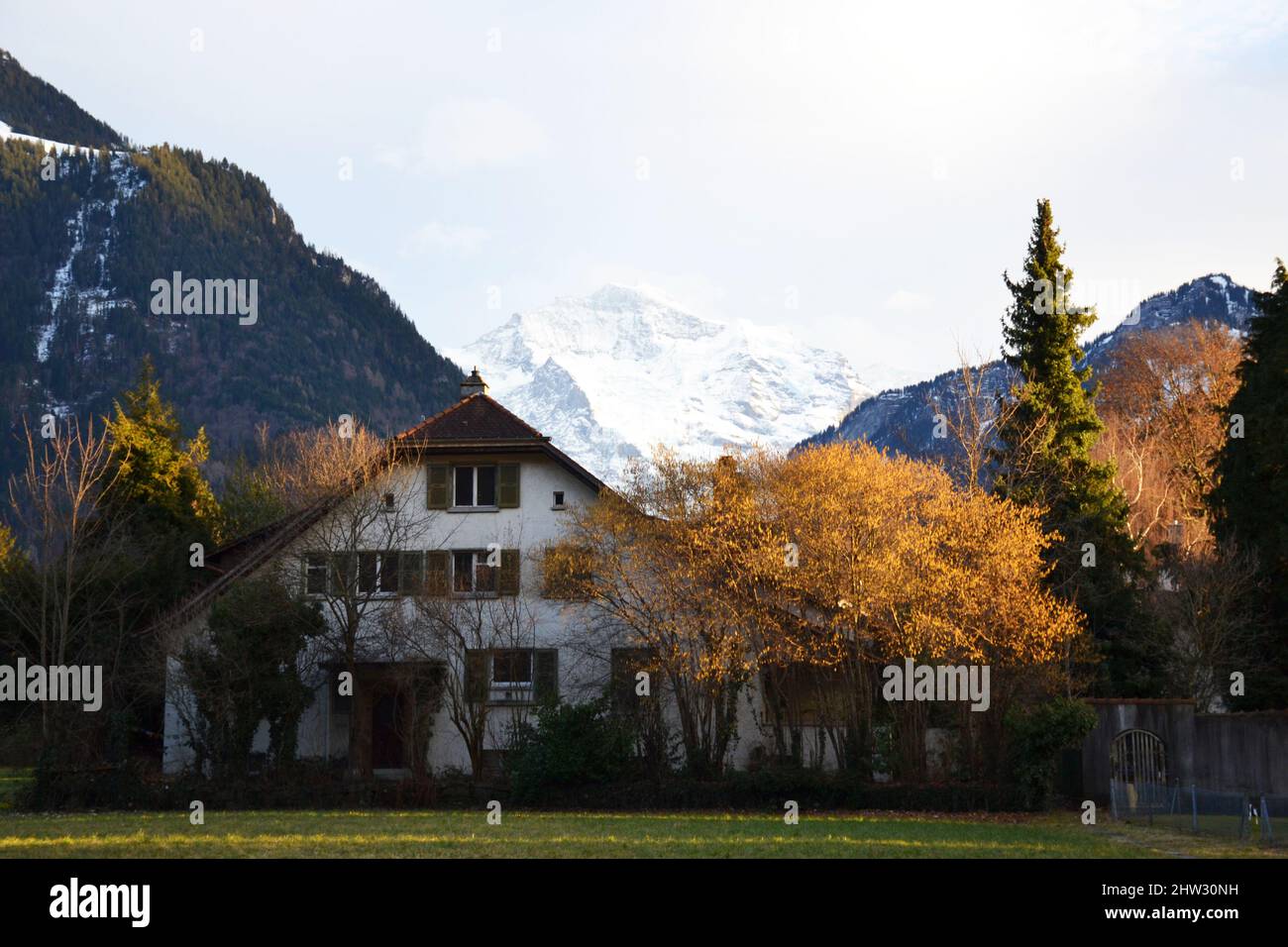 Old Swiss house over the mountain background Stock Photo - Alamy