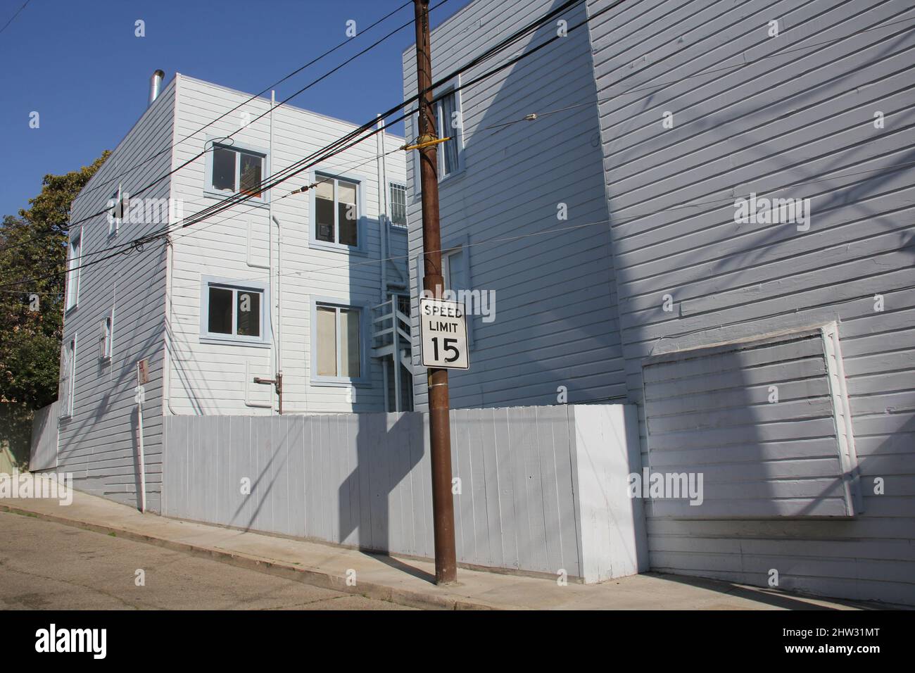 House near industrial building hi-res stock photography and images - Alamy