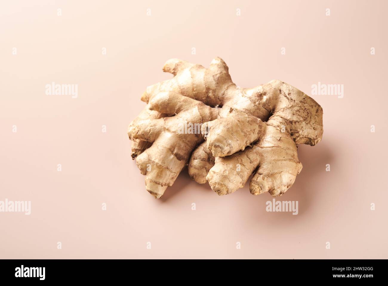 Ginger root. Fresh ginger root on a beige background. Vitamins. Virus ...