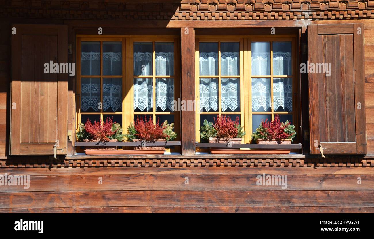 Old style open windows of a house in a swiss village Stock Photo - Alamy
