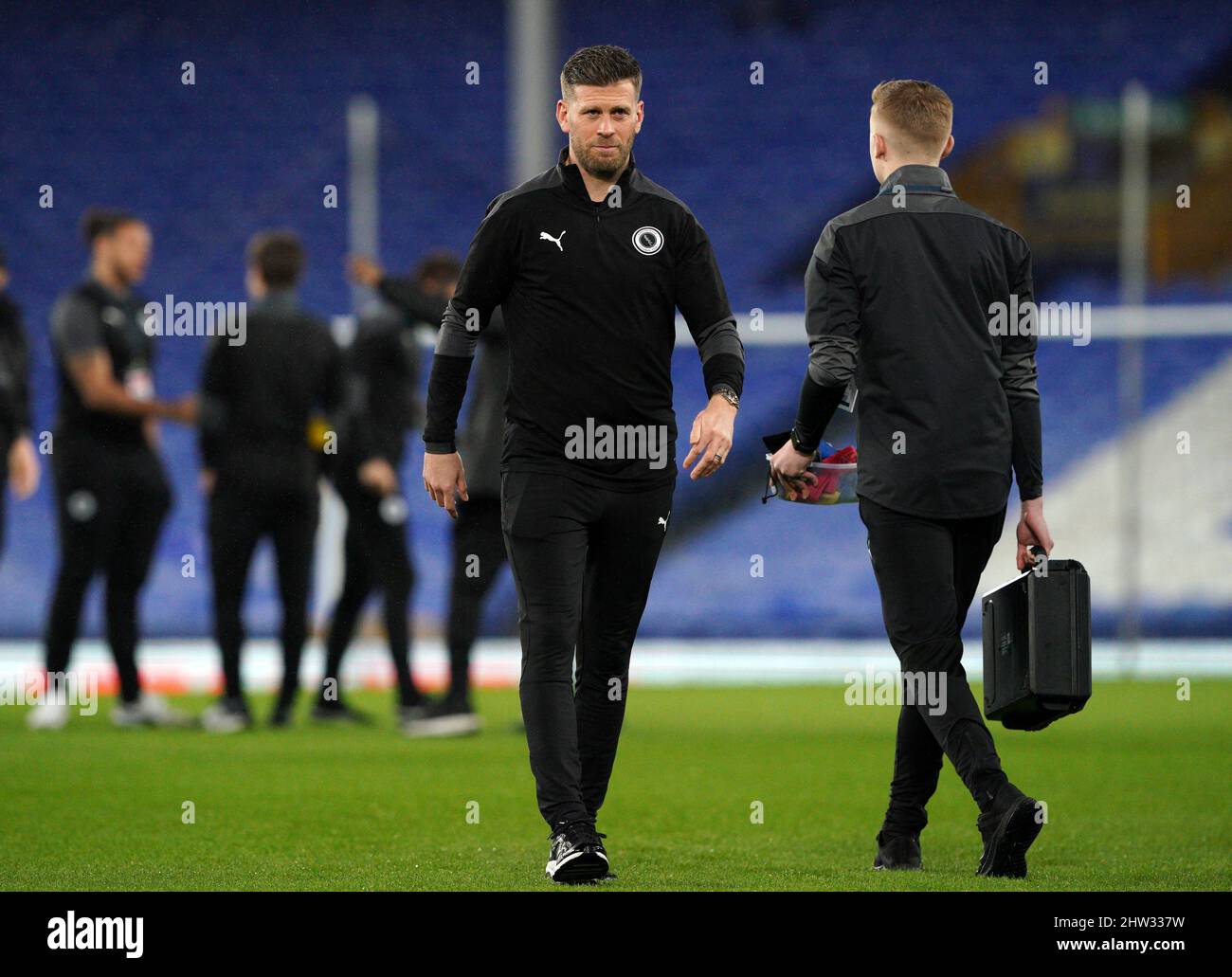Boreham Wood manager Luke Garrard (centre) inspects the pitch before ...