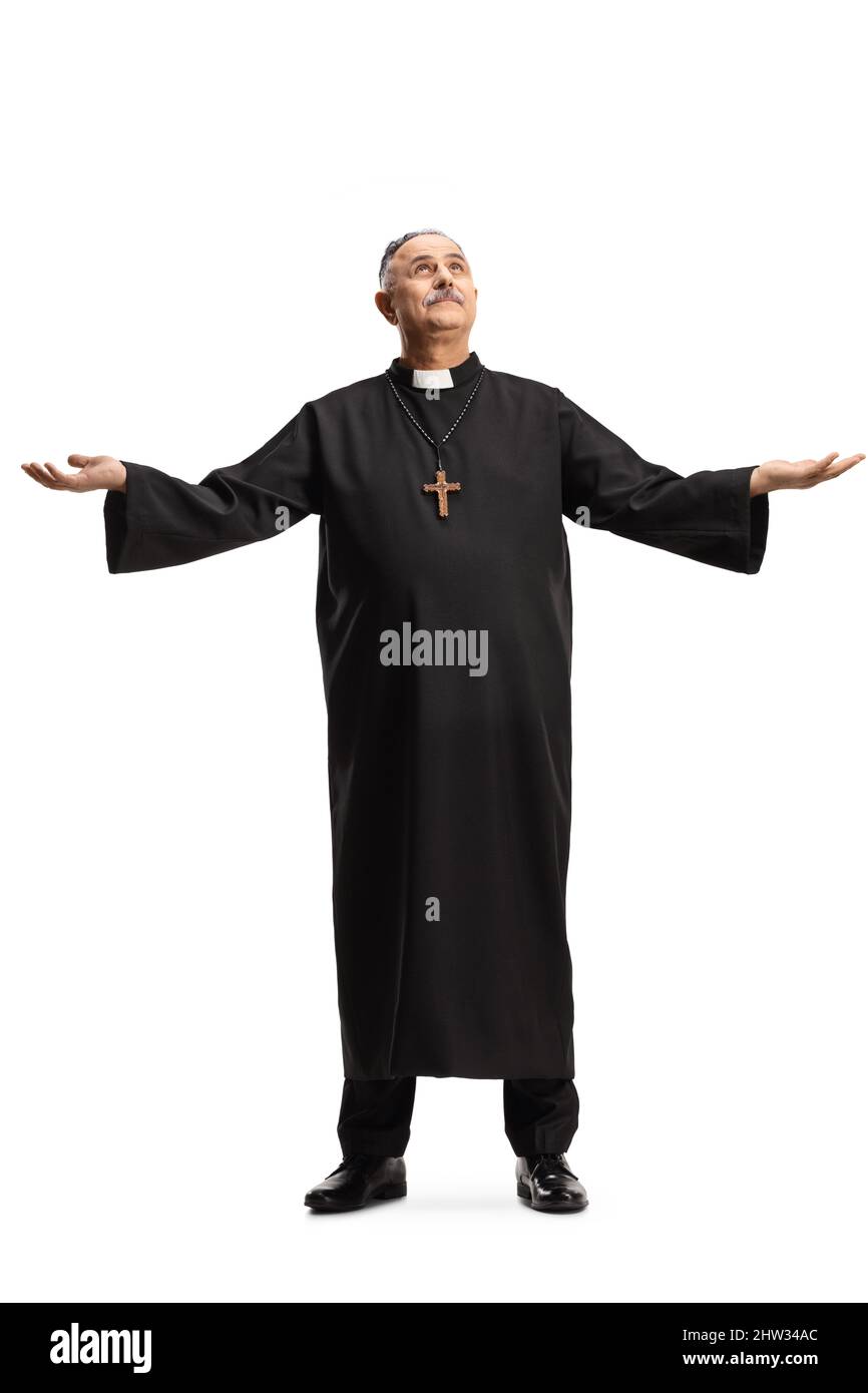 Full length portrait of a mature priest standing and raising arms ...