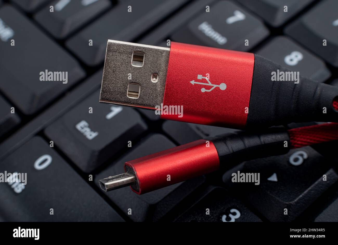 The usb cable for charging peripherals is on the keyboard in black ...