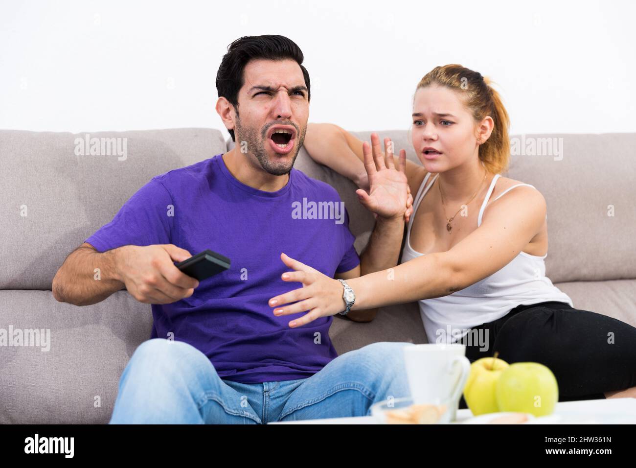 Couple arguing home tv hi-res stock photography and images - Alamy