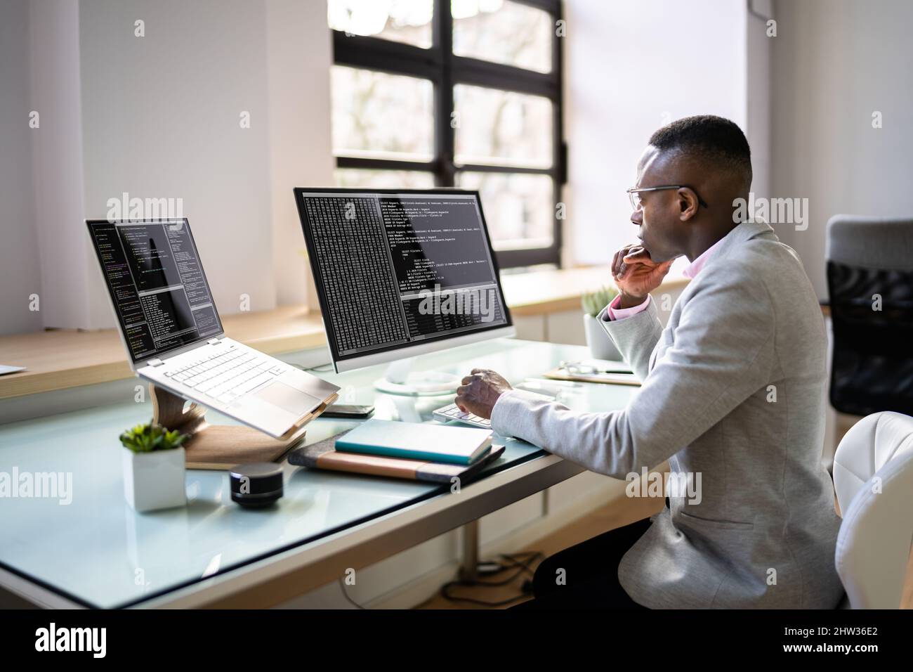 African American Man Programmer. Girl Coding On Computer Stock Photo ...