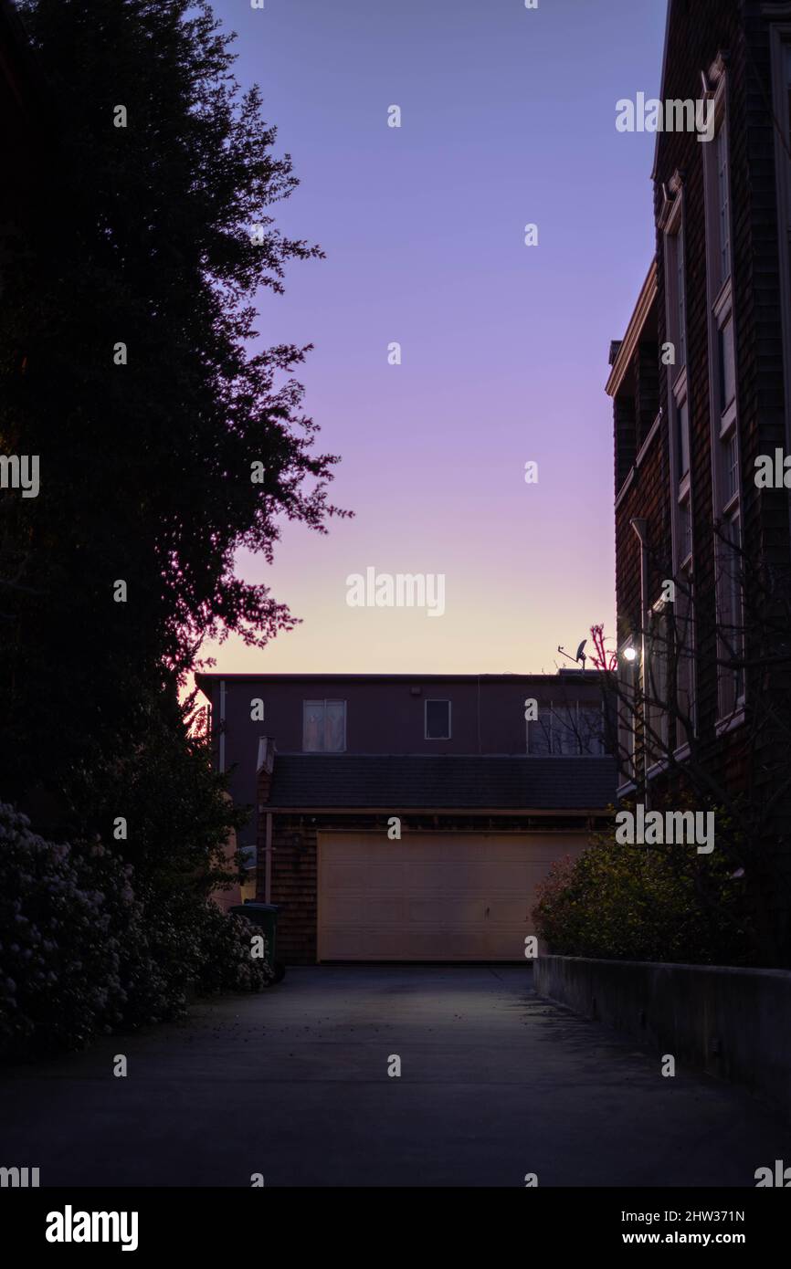 Garage with sunset sky on the background Stock Photo - Alamy