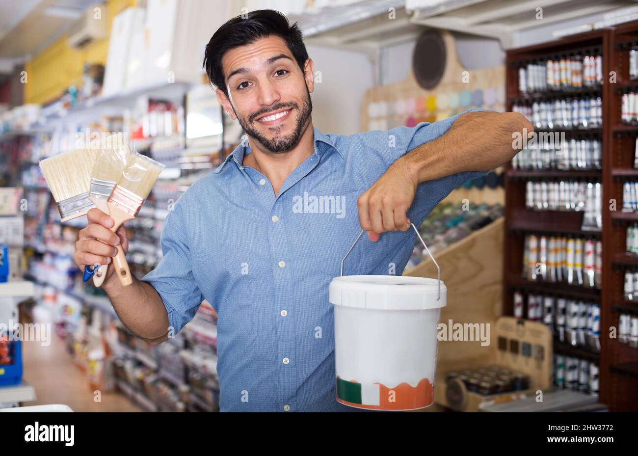 Male buyer in paint store Stock Photo - Alamy