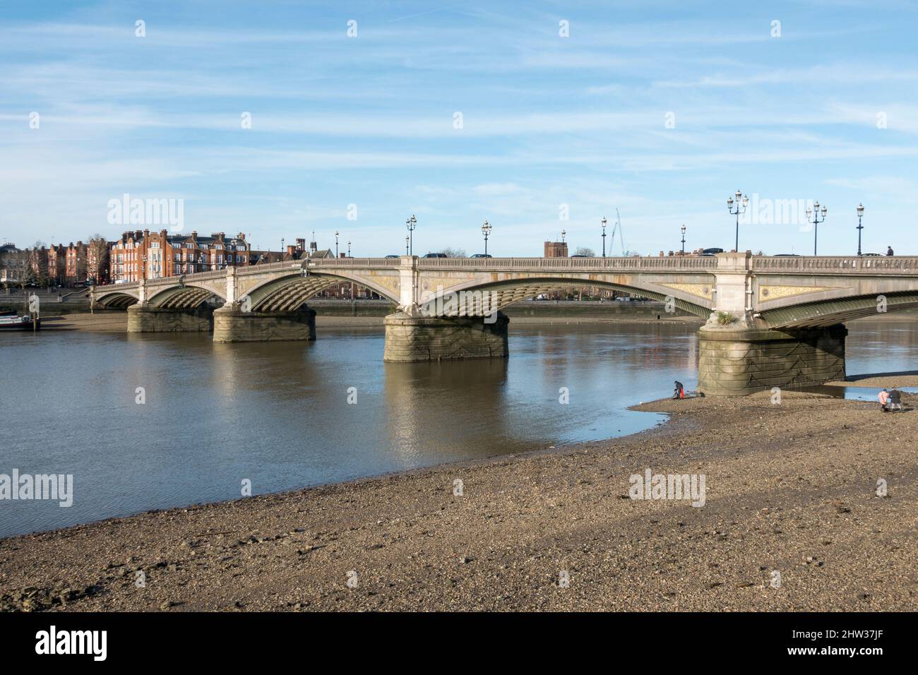 Battersea Bridge (designed by Joseph Bazalgette) at low tide on the ...