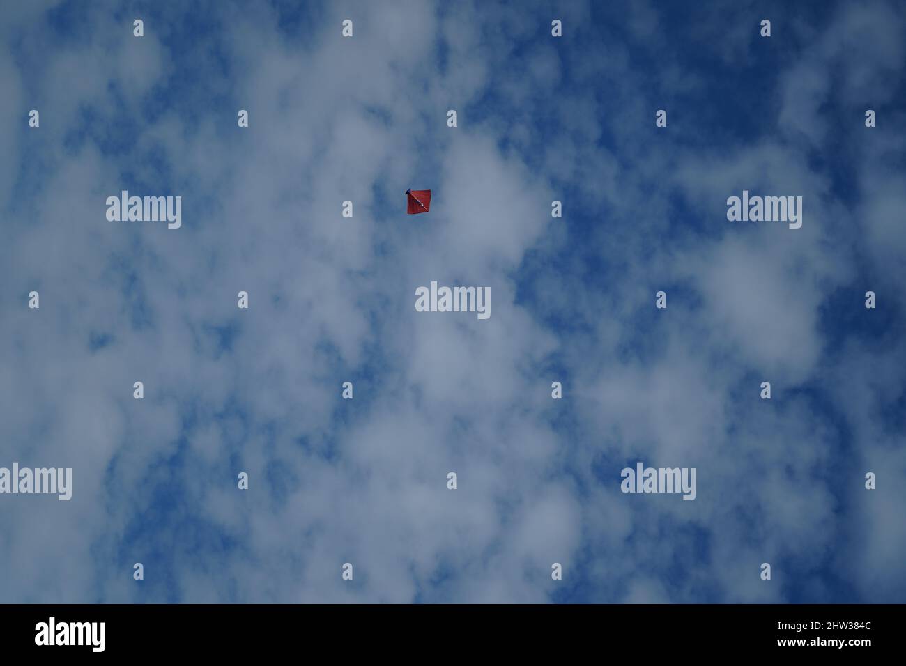 Vertical shot of a red kite flying in the sky at night Stock Photo - Alamy