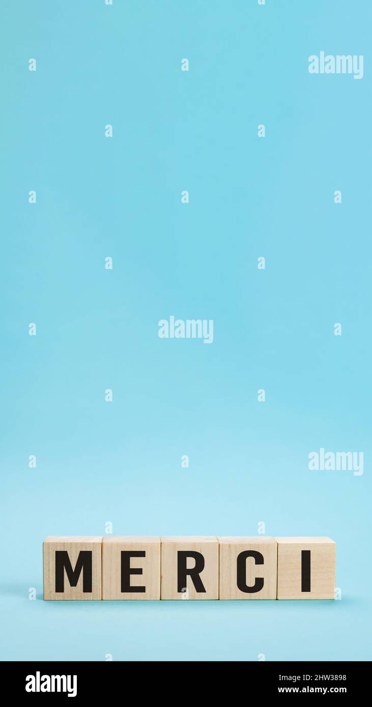 Merci - Thank you in French language. Merci Word on Letter Tiles Stock ...