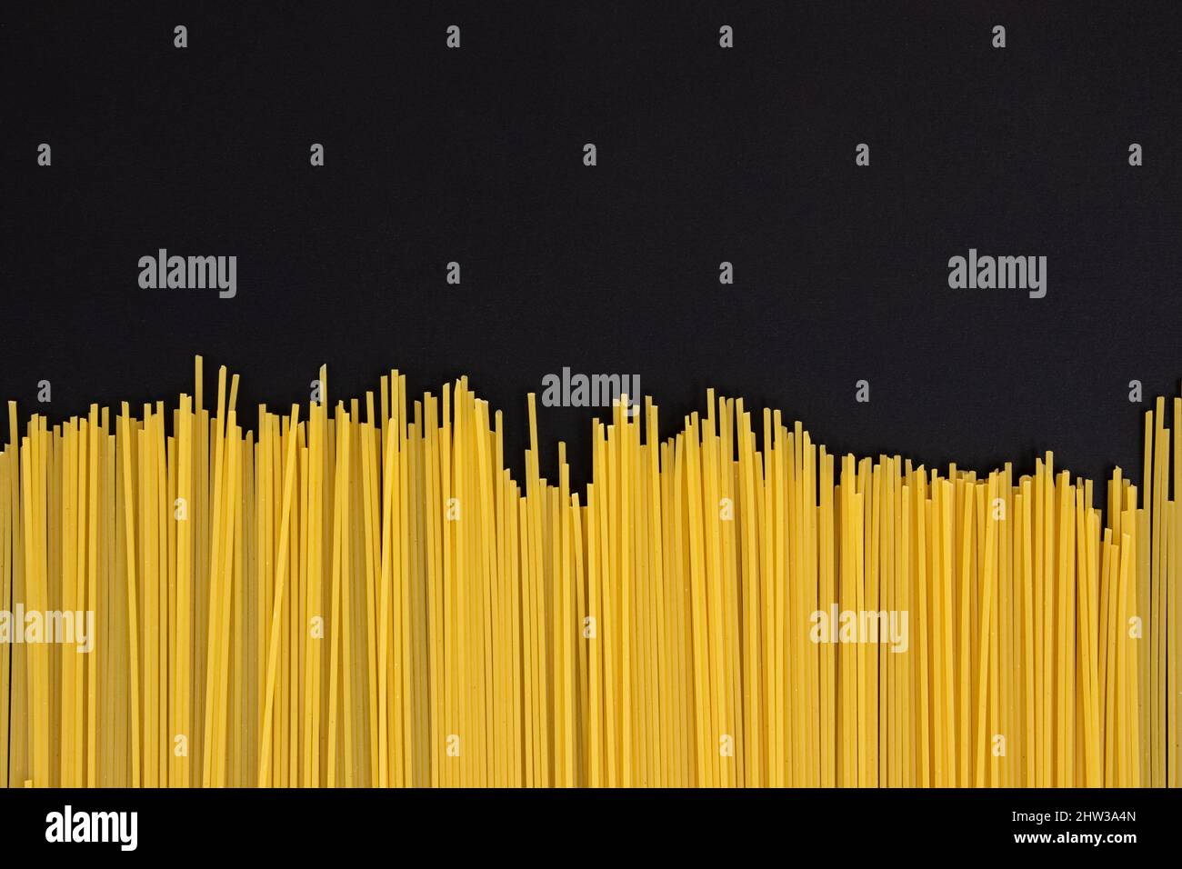 frame of uncooked italian spaghetti with copy space for text, close up ...