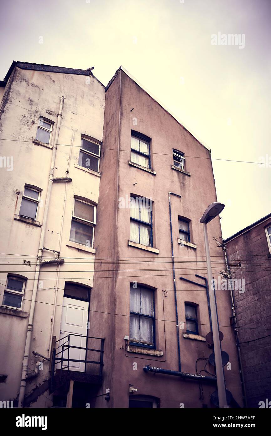 Rear of four storey seafront flats and hotel Stock Photo - Alamy