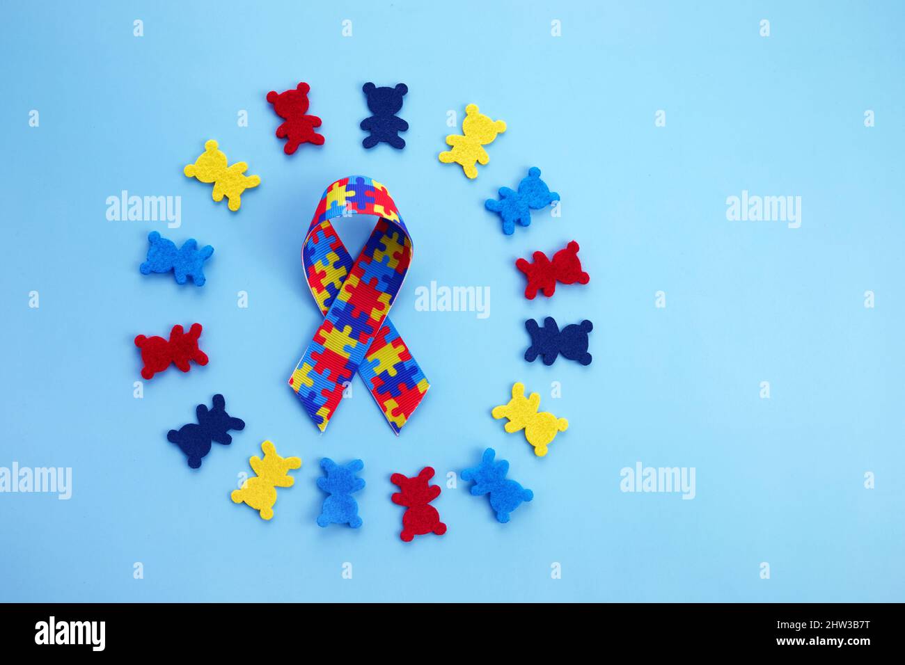 Autism awareness concept with colorful teddy bears on blue background ...