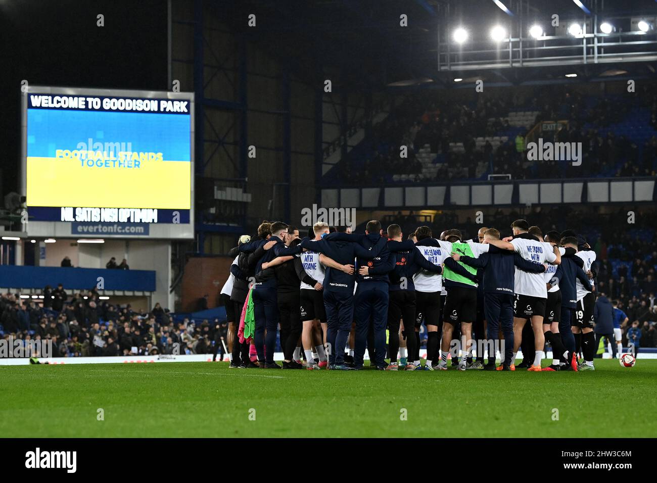 The players and staff of Boreham Wood huddle at the end of the pre ...