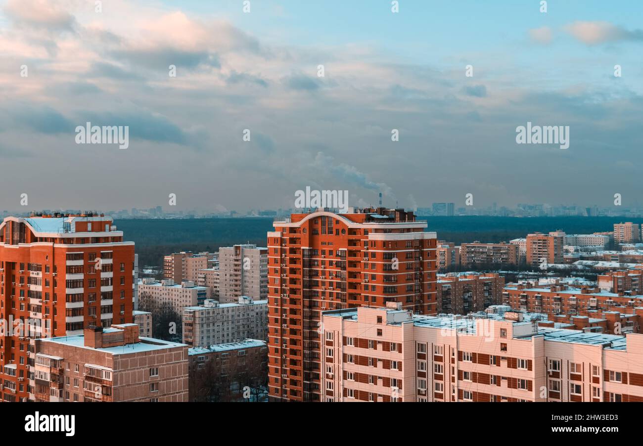 View of the big city from above. Metropolis under high blue sky with ...