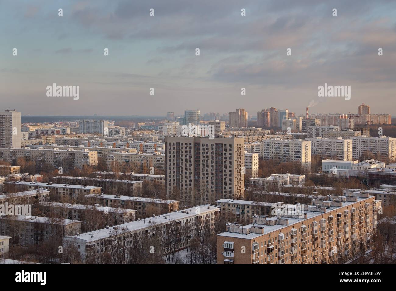 View of the big city from above. Metropolis under high blue sky with ...