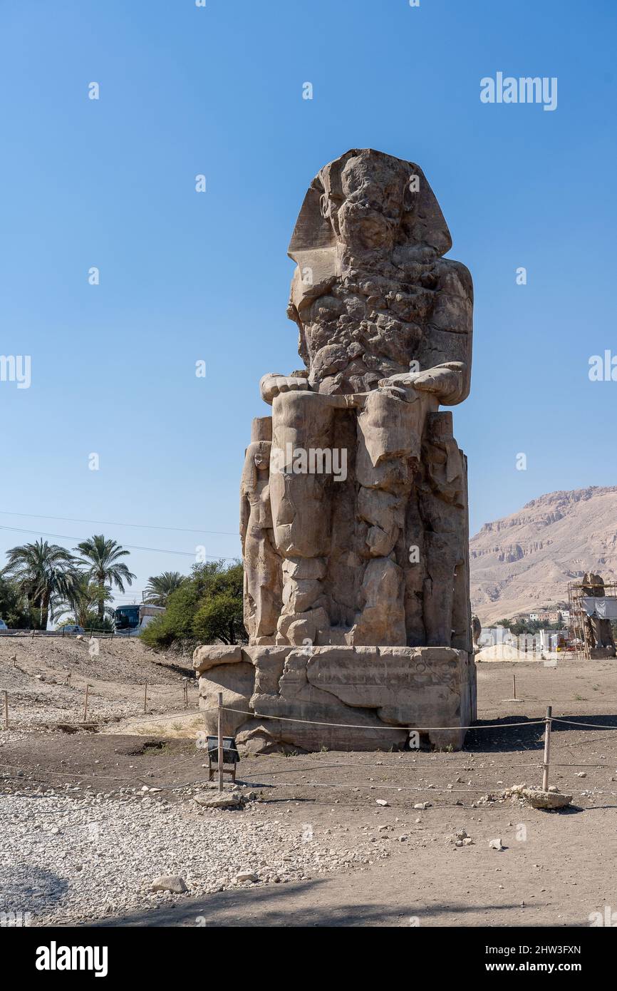 Colossi of Memnon - statues of Pharaoh Amenhotep III. Tall stone statue ...